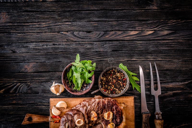 Grilled meat on a table stock image. Image of black - 131666033
