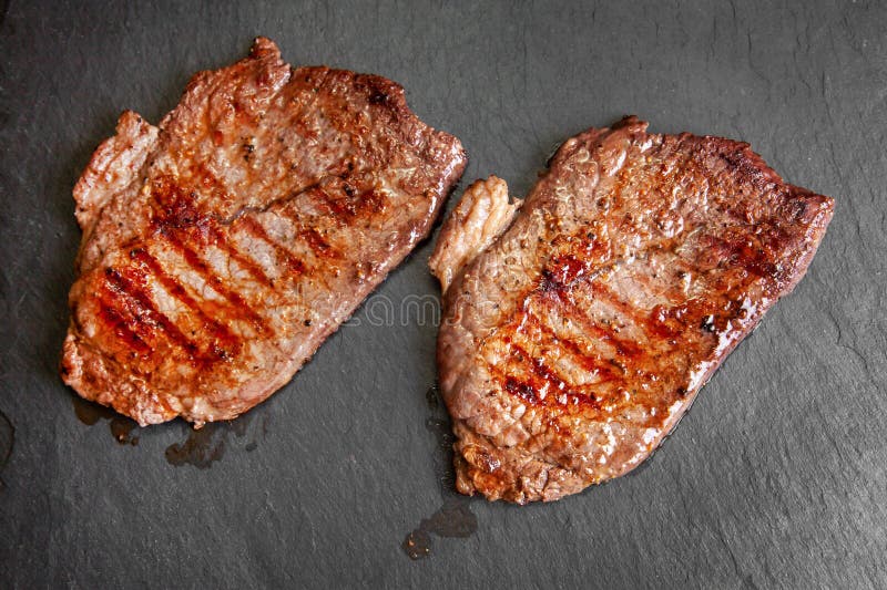 Grilled Minute Steak of Marbled Beef on a Stone Slate Board, Close Up ...