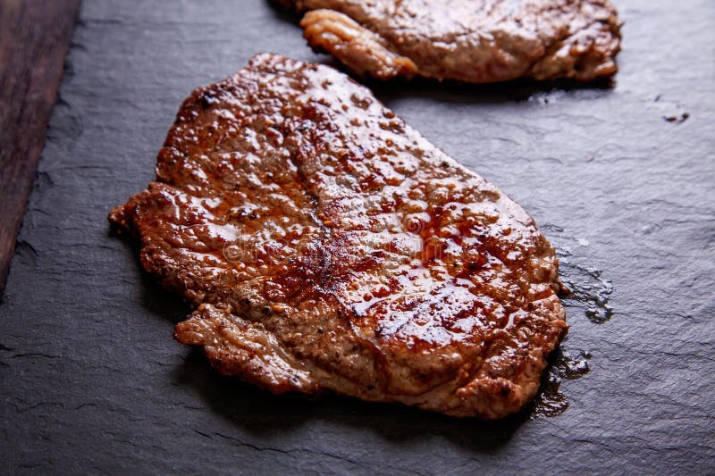 Grilled Minute Steak of Marbled Beef on a Stone Slate Board, Close Up ...
