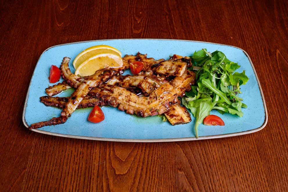 Grilled Octopus with Lemon on Plate. Stock Image - Image of tentacle ...