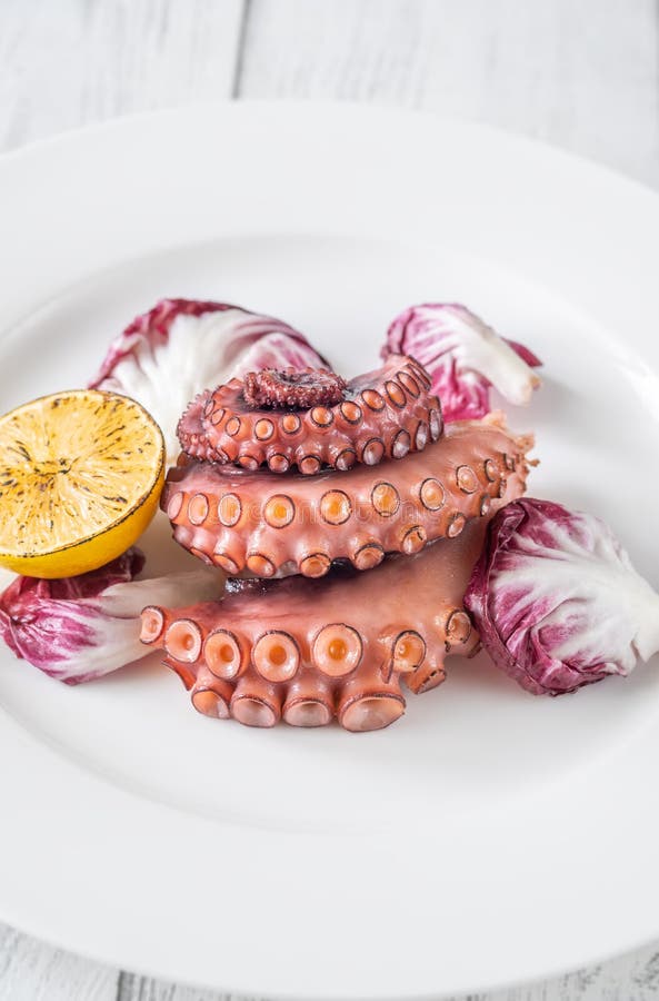 Grilled Octopus with lemon stock photo. Image of charcoal - 341955480