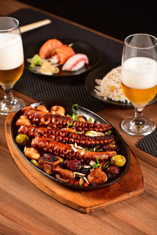 Grilled Octopus Served with Rice and Beer Stock Photo - Image of ...