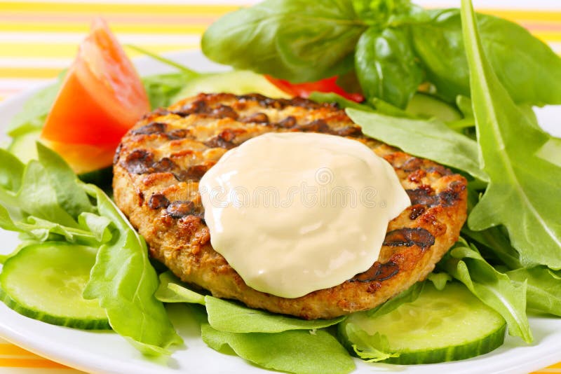 Grilled Patty with Rocket and Cucumber Salad Stock Photo - Image of ...