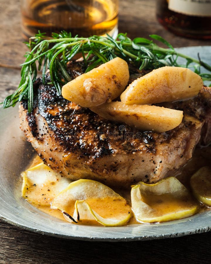 Grilled Pork Chop with Bourbon Spiced Maple Apples Served with R Stock ... Grilled Pork Chop with Bourbon Spiced Maple Apples Served with R Stock ...