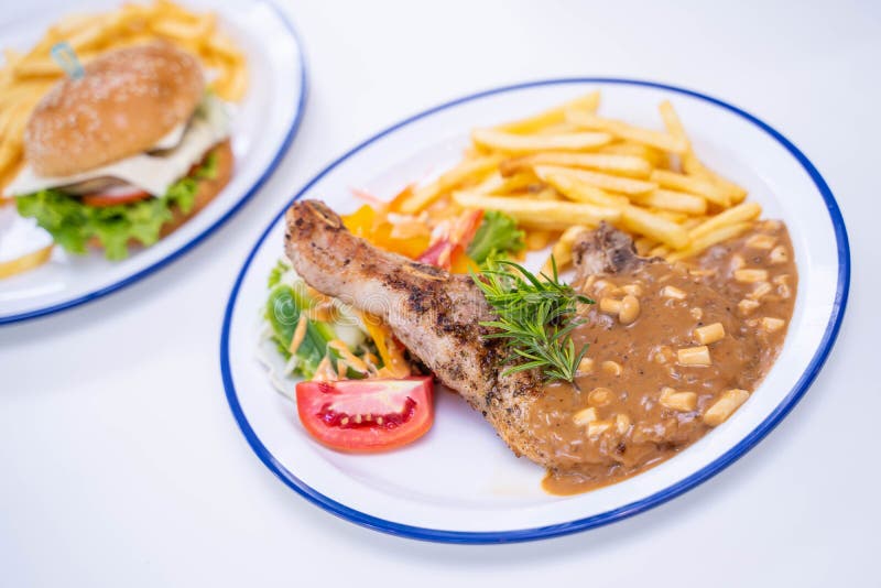 Grilled Pork Chop Serve with French Fried Stock Image - Image of french ...