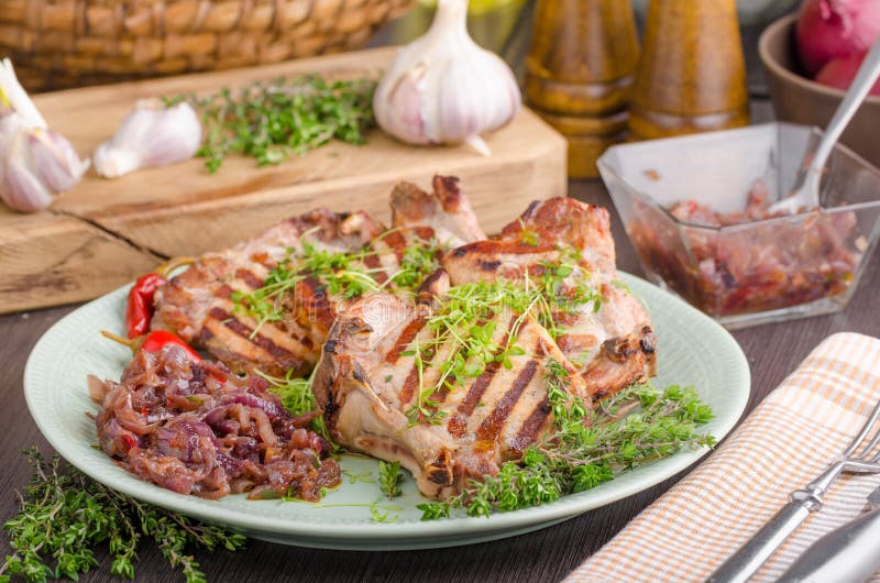 Grilled pork chops stock image. Image of meal, green - 100144521