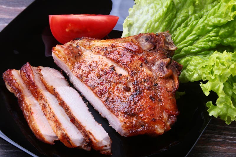 Grilled Pork Chops with Tomato, Leaves Lettuce and Ketchup on Plate ...