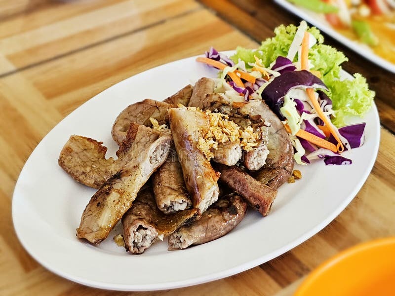 Grilled Pork Intestines with Fried Garlic Stock Image - Image of ...
