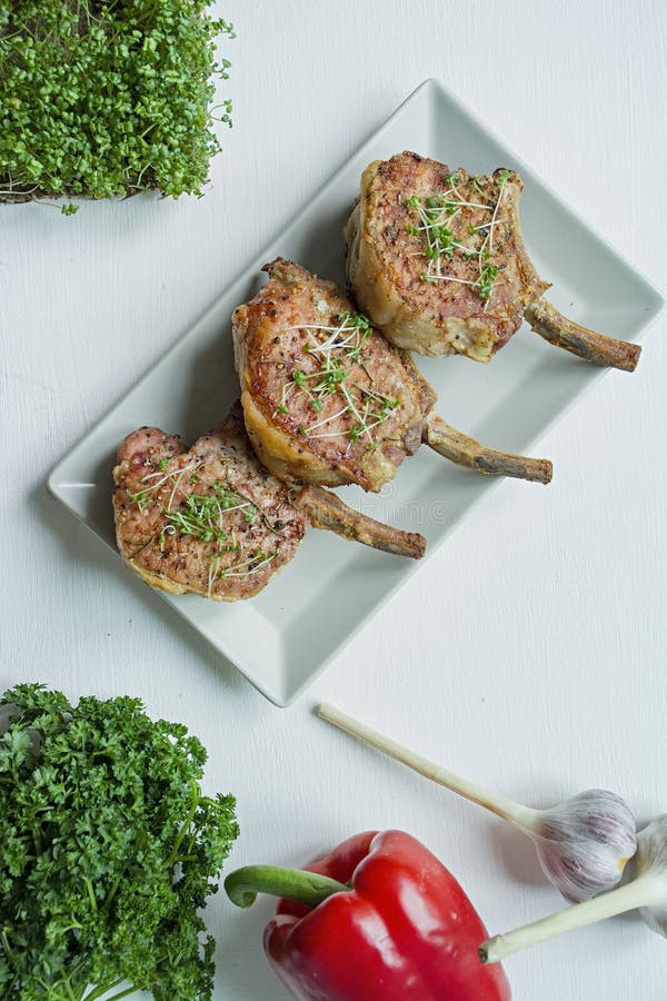 Grilled Pork Ribs Steaks with Spices and Herbs. Steaks on the Bone in a ...