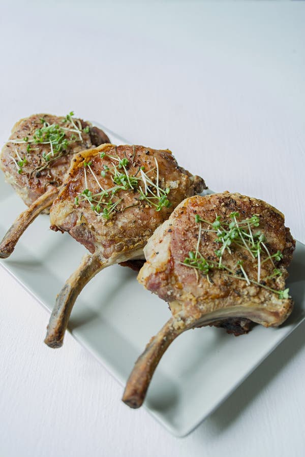 Grilled Pork Ribs Steaks with Spices and Herbs. Steaks on the Bone in a ...