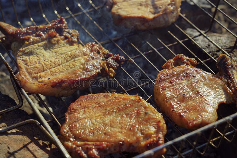 Grilled Pork Steaks Lay Over Coals on a Grill Stock Photo - Image of ...