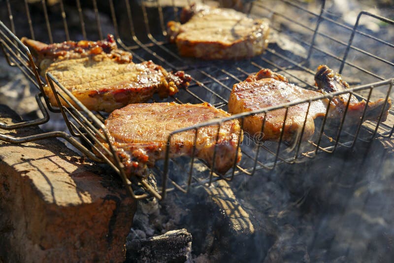 Grilled Pork Steaks Lay Over Coals on a Grill Stock Photo - Image of ...
