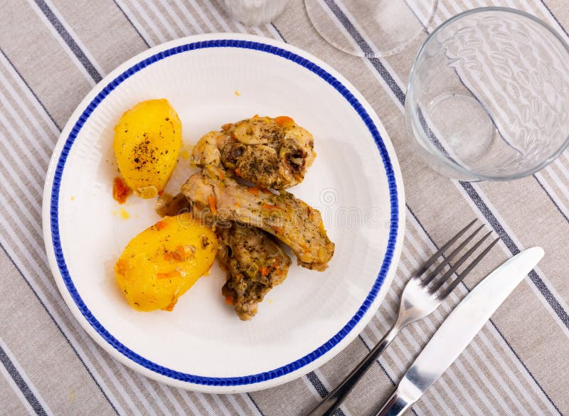 Grilled Rabbit Leg Quarters Served on Plate with Boiled Potatoes ...