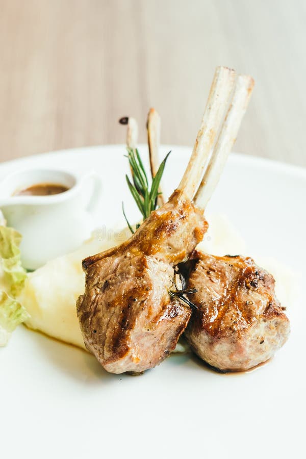 Grilled Rack of Lamb Meat with Sauce Stock Photo - Image of board ...