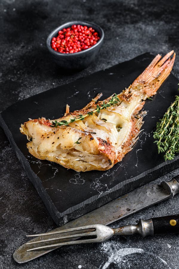 Grilled Red Sea Perch on a Cutting Board. Black Background. Top View ...