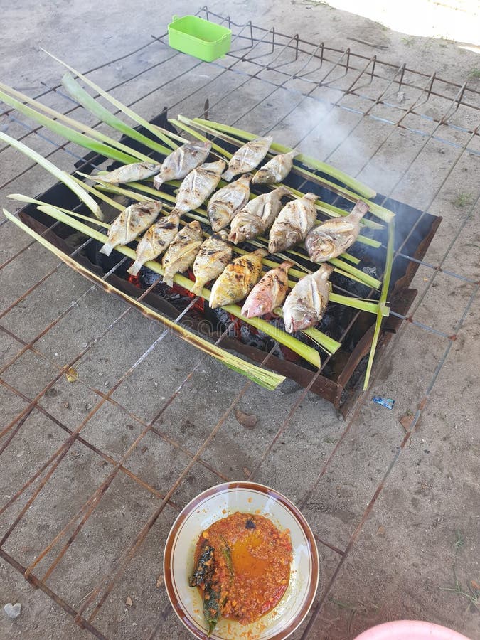 Grilled Reef Fish Using Coconut Shell in Maluku Stock Photo - Image of ...