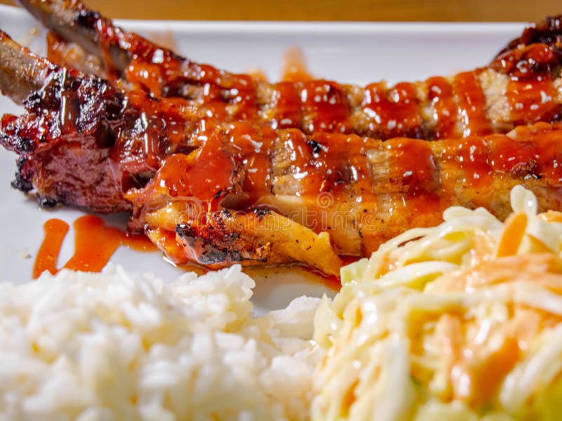 Grilled Ribs Served with Rice and Vegetable Salad Stock Image - Image ...