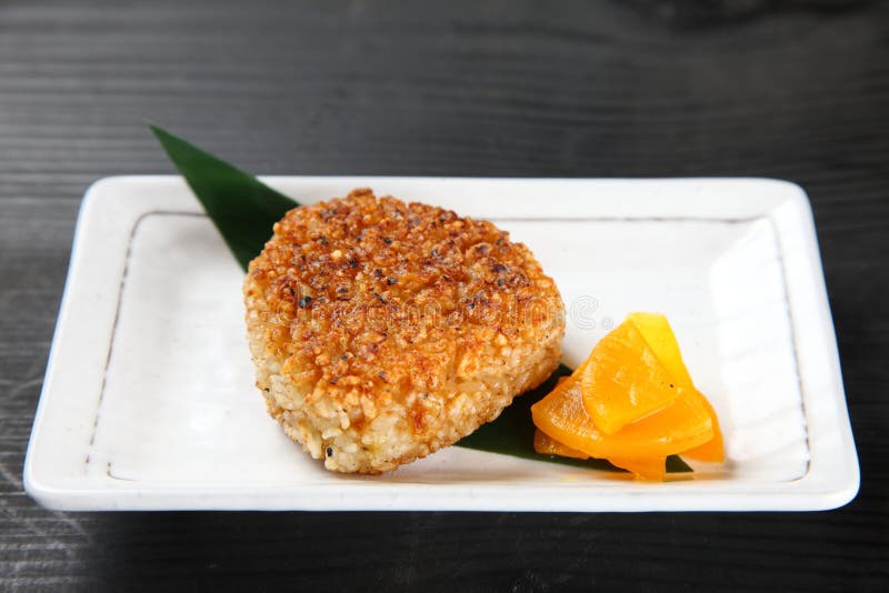 Grilled Rice Ball with Yellow Pickled Radish Stock Image - Image of ...