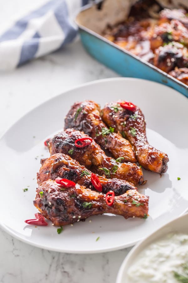 Grilled Roasted and Barbecue Chicken Legs on White Plate Stock Photo ...