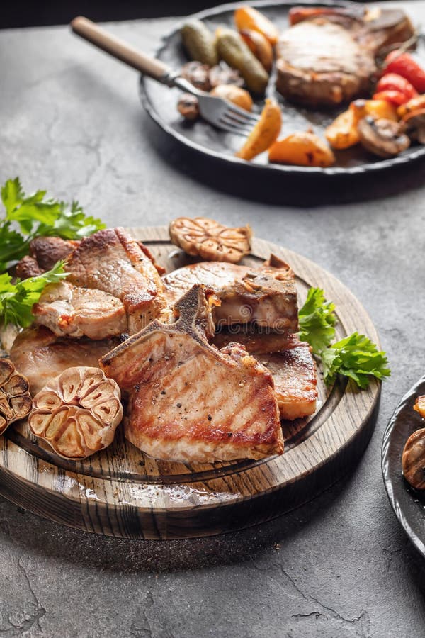 Grilled Roasted Bbq Pork Stake Served with Vegetables on Brown Table ...