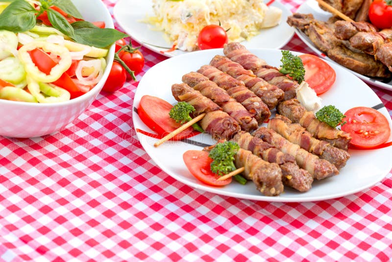 Grilled Rolled Kebab with Bacon and Salad - Delicious Meal Stock Photo ...