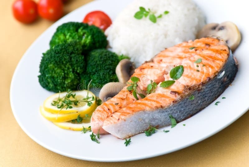 Grilled Salmon with Broccoli Rice and Tomato- Clos Stock Image - Image ...