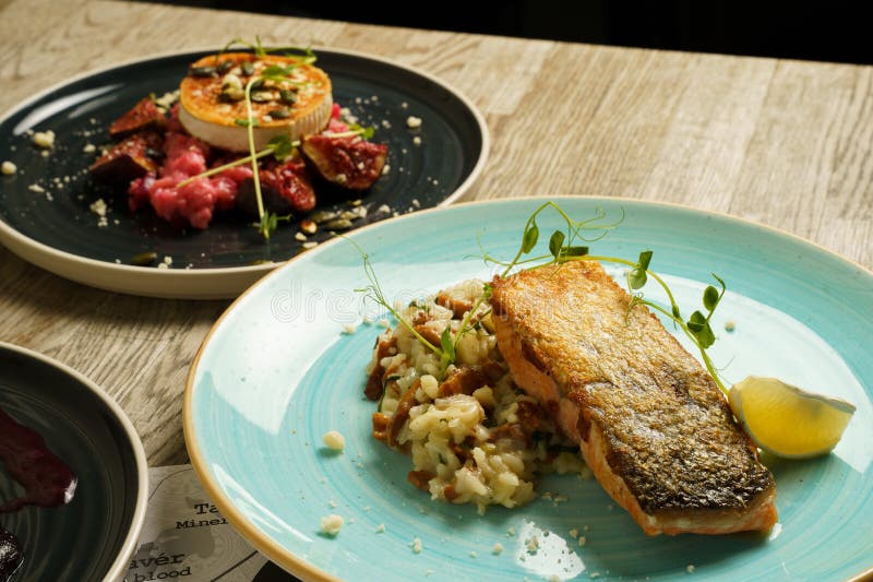 Grilled Salmon with Risotto and Chanterelle Mushrooms Stock Image ...
