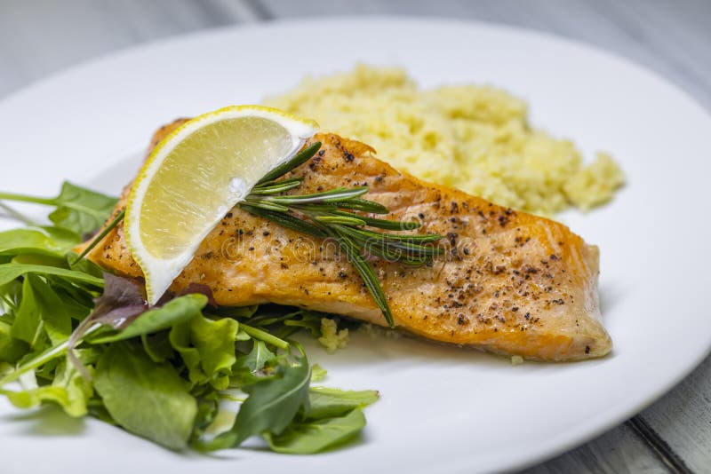 Grilled Salmon Served with Couscous and Vegetables Salad Stock Image ...