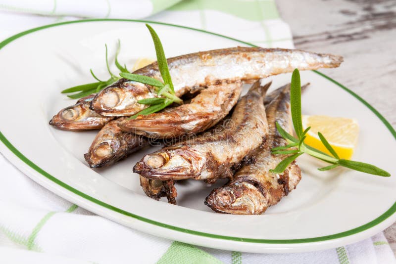Grilled sardines on plate. stock photo. Image of appetizer - 49763074