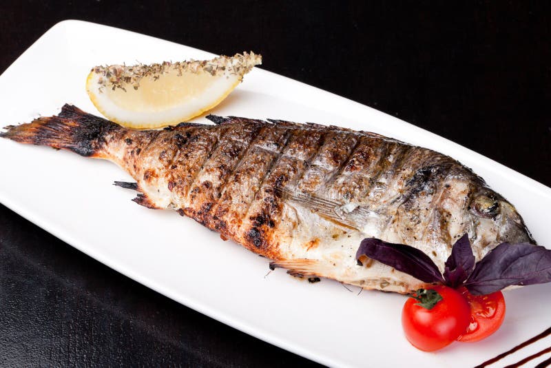 Grilled Sea Bream stock photo. Image of dorado, dishware - 30997348