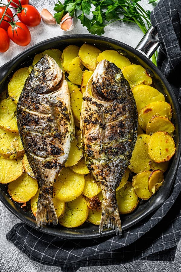 Sea Bream Fish. Mediterranean Cuisine, Healthy Cooking Concept. Black ...
