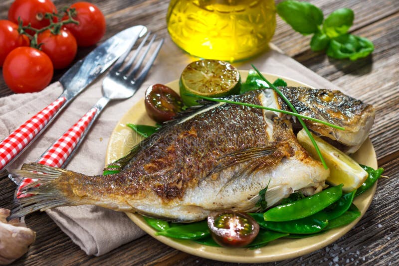 Grilled sea bream fish stock photo. Image of cooking - 65861612
