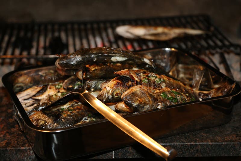 Grilled Sea Fish Stands on the Table Stock Photo - Image of plate, food ...
