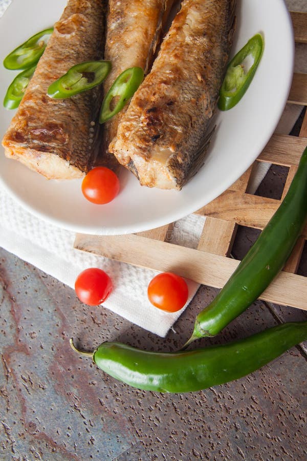Grilled shad with tomato stock image. Image of meal, onion - 72967989