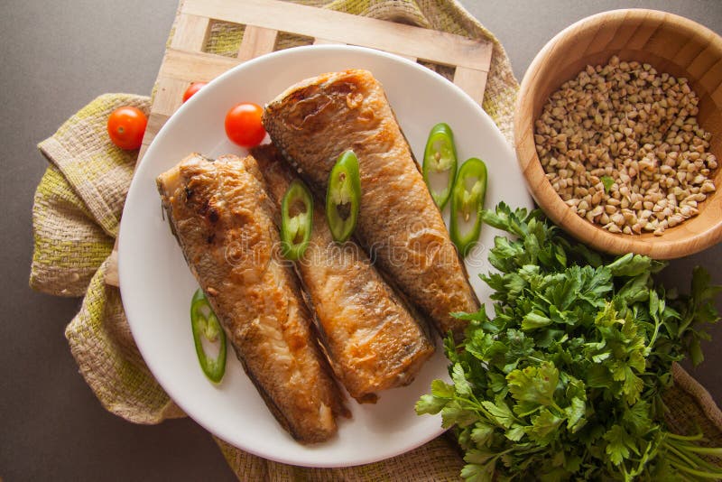 Grilled shad with tomato stock image. Image of chili - 74071583