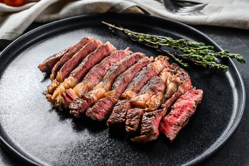 Grilled Sliced Steak Rib Eye with Pepper. Black Background Stock Image ...