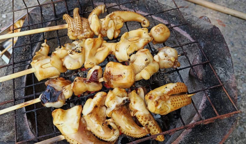 Top View Grilled Squid on Charcoal Turtle. Grilled Seafood. Stock Photo ...