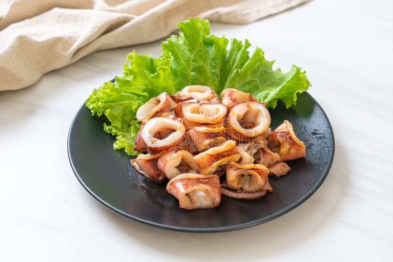 Grilled squid on plate stock image. Image of restaurant - 158496713