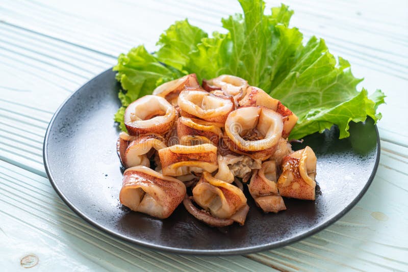 Grilled squid on plate stock photo. Image of food, cuisine - 160967218