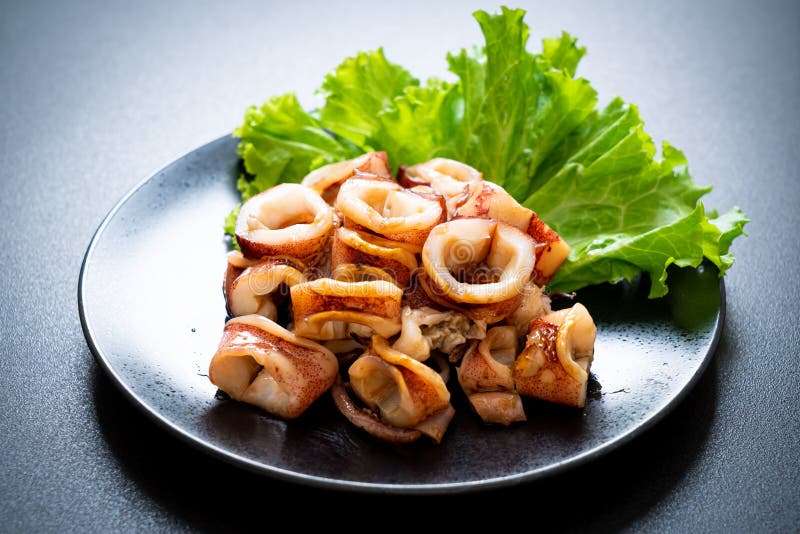 Grilled squid on plate stock image. Image of nature - 214687793