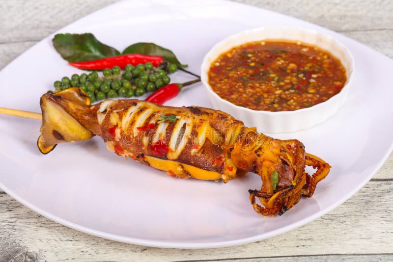 Grilled Squid with Sauce and Hebs Stock Photo - Image of plate, closeup ...