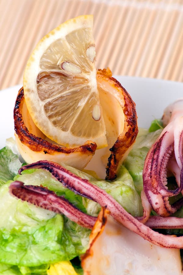 Grilled Squids with Lemon stock image. Image of healthy - 12426641