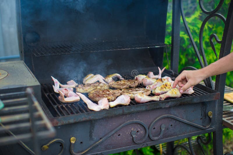 Grilled Steak and Chiken Cooking on an Open Barbecue Stock Image ...