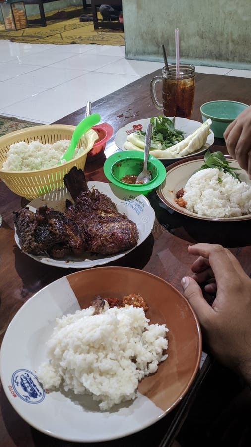 Grilled Tilapia and Rice for Lunch on One Table Editorial Photo - Image ...
