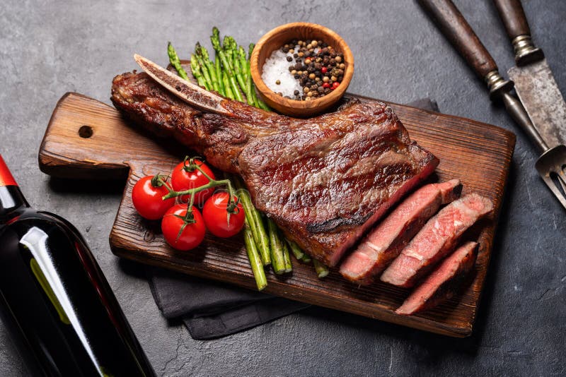 Grilled Tomahawk Beef Steak with Asparagus Stock Photo - Image of ...
