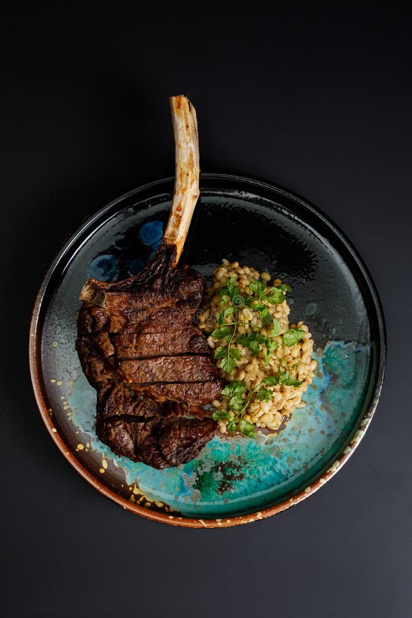 Grilled tomahawk steak stock image. Image of food, beefsteak - 265619977