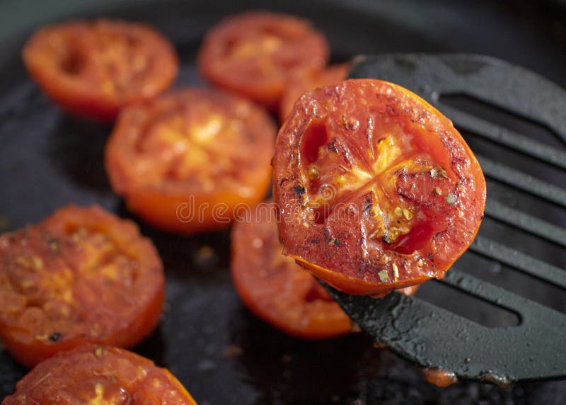 Grilled tomato on pan stock image. Image of cooking - 149679073