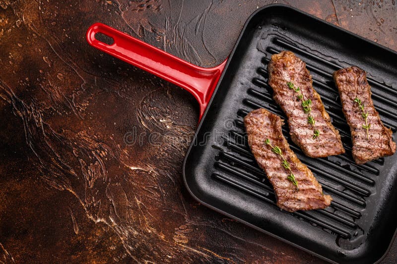 Grilled Tri Tip Steaks, Marbled Beef Meat on Pan with Herbs. Brown ...