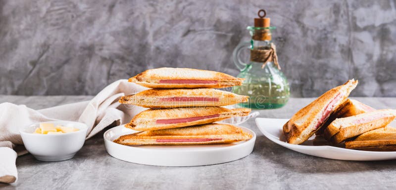 Grilled Triangle Sandwiches with Cheese and Sausage on a Plate on a ...