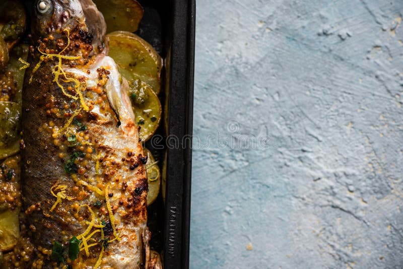 Grilled Whole Fish on Potatoes. Top Down View Stock Photo - Image of ...